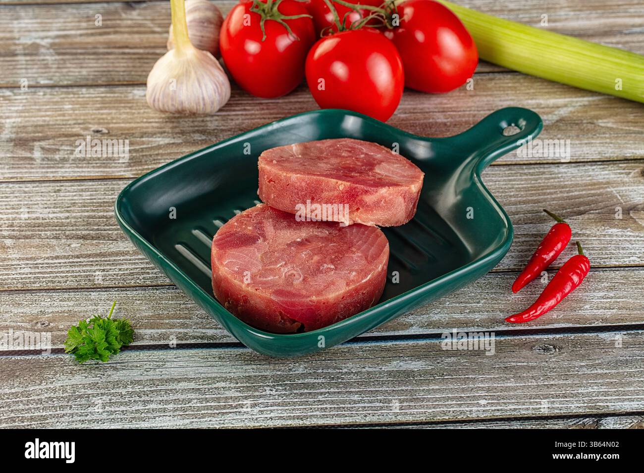 Raw round tuna fish uncucked fillet Stock Photo - Alamy