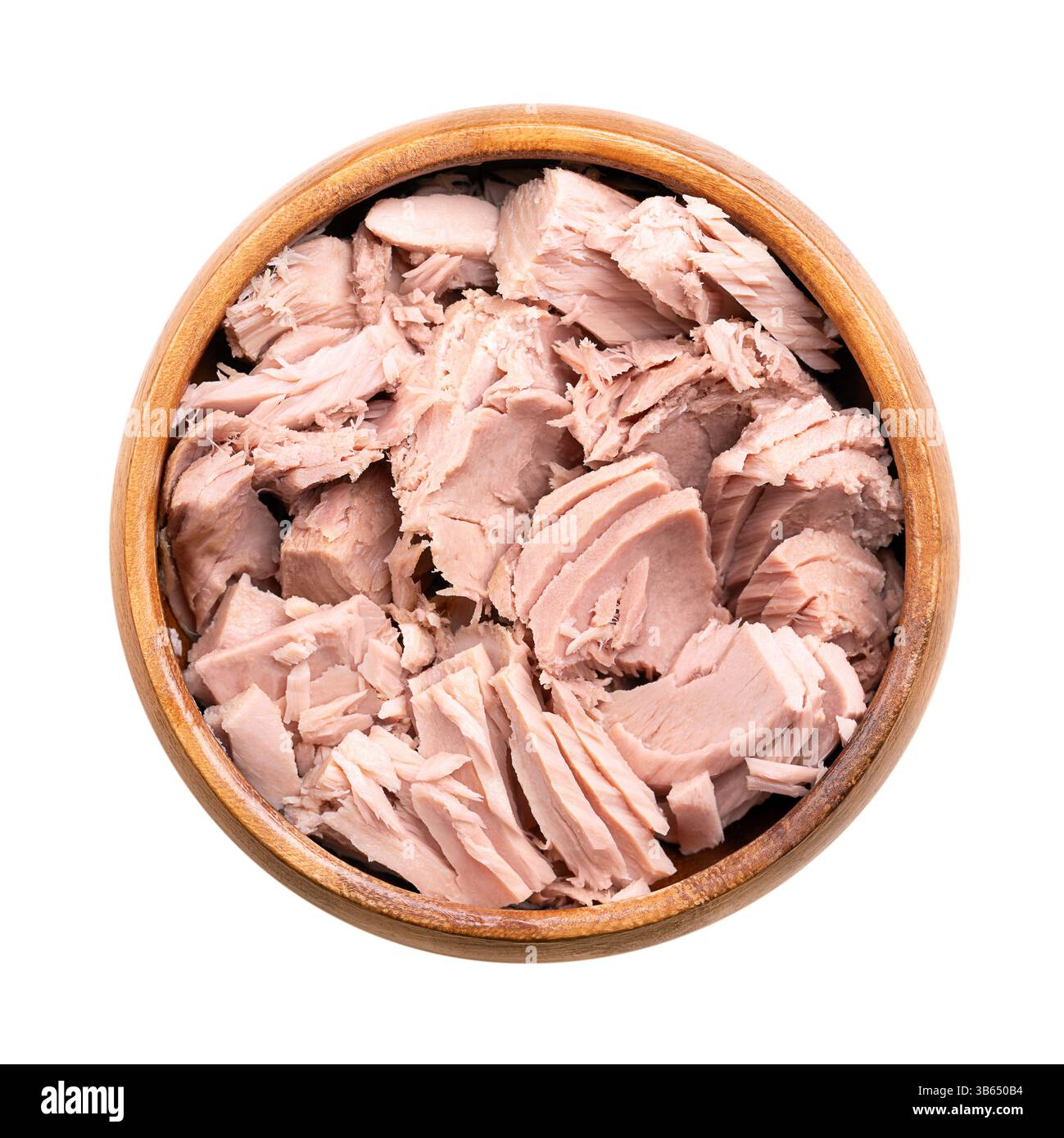 Canned tuna, tuna fish in its own juice in a wooden bowl. Fillets of ...