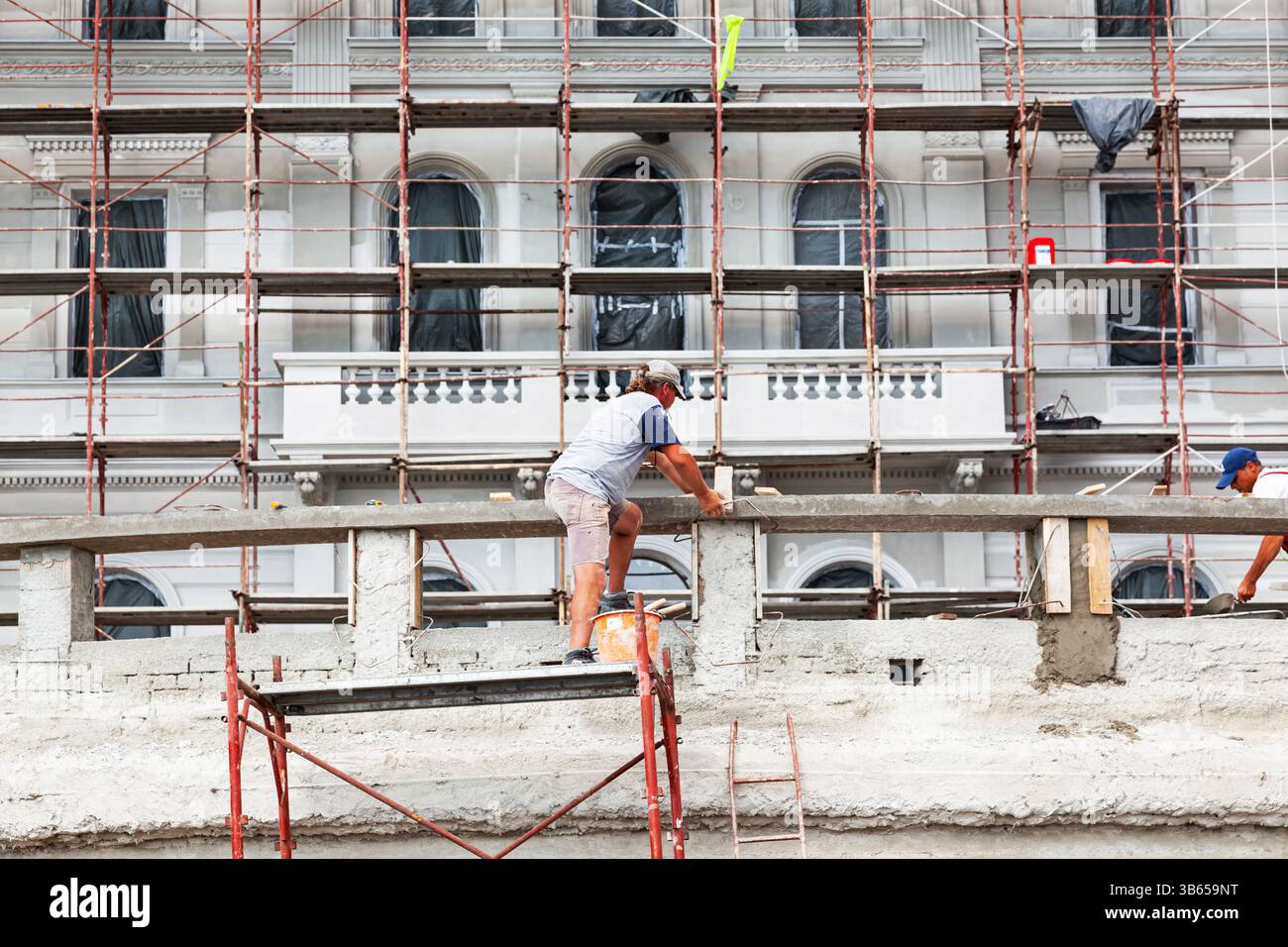 Reconstruction of an ancient building using scaffolding Stock Photo - Alamy