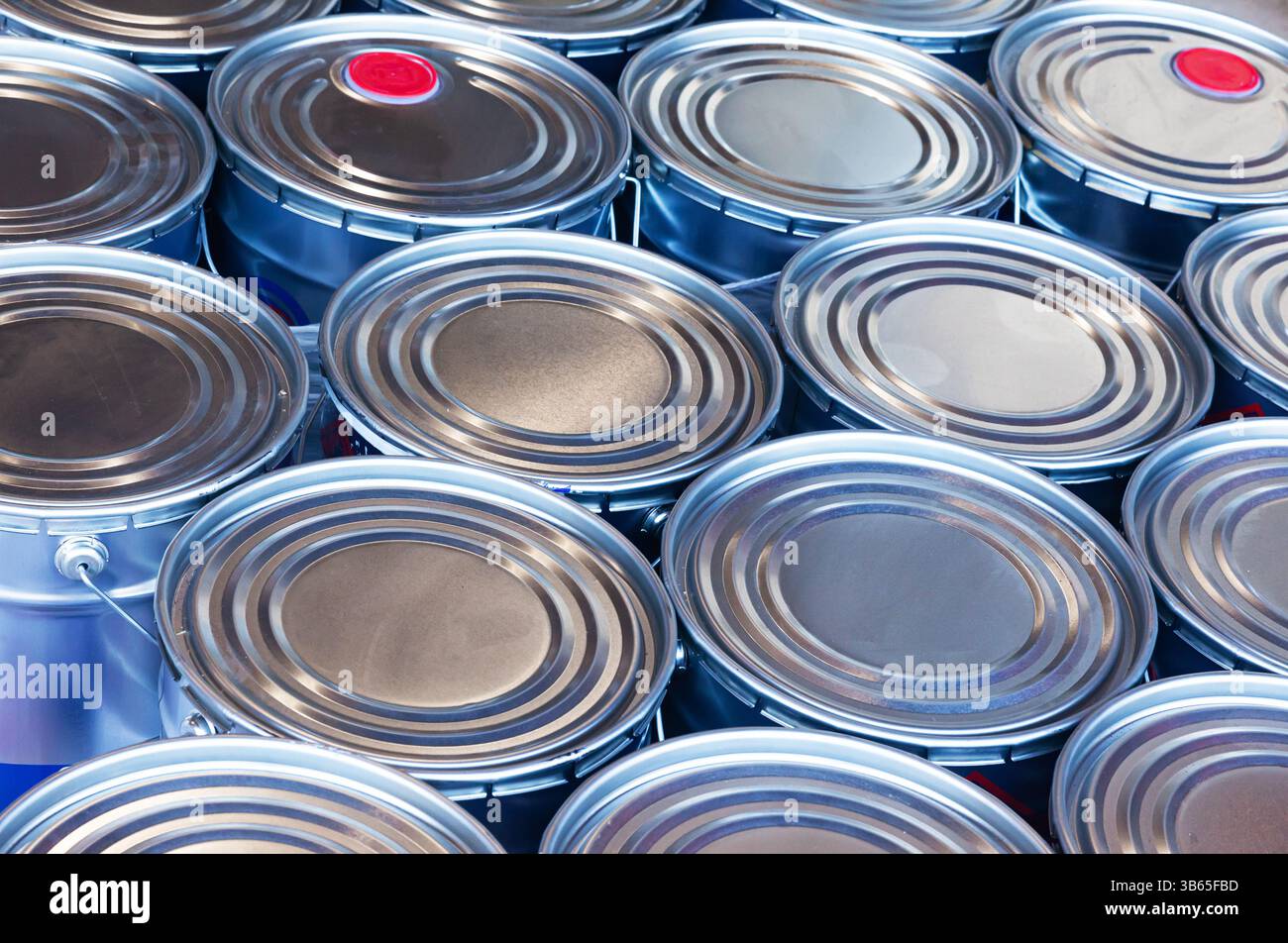New sealed paint buckets stacked next to each other Stock Photo - Alamy