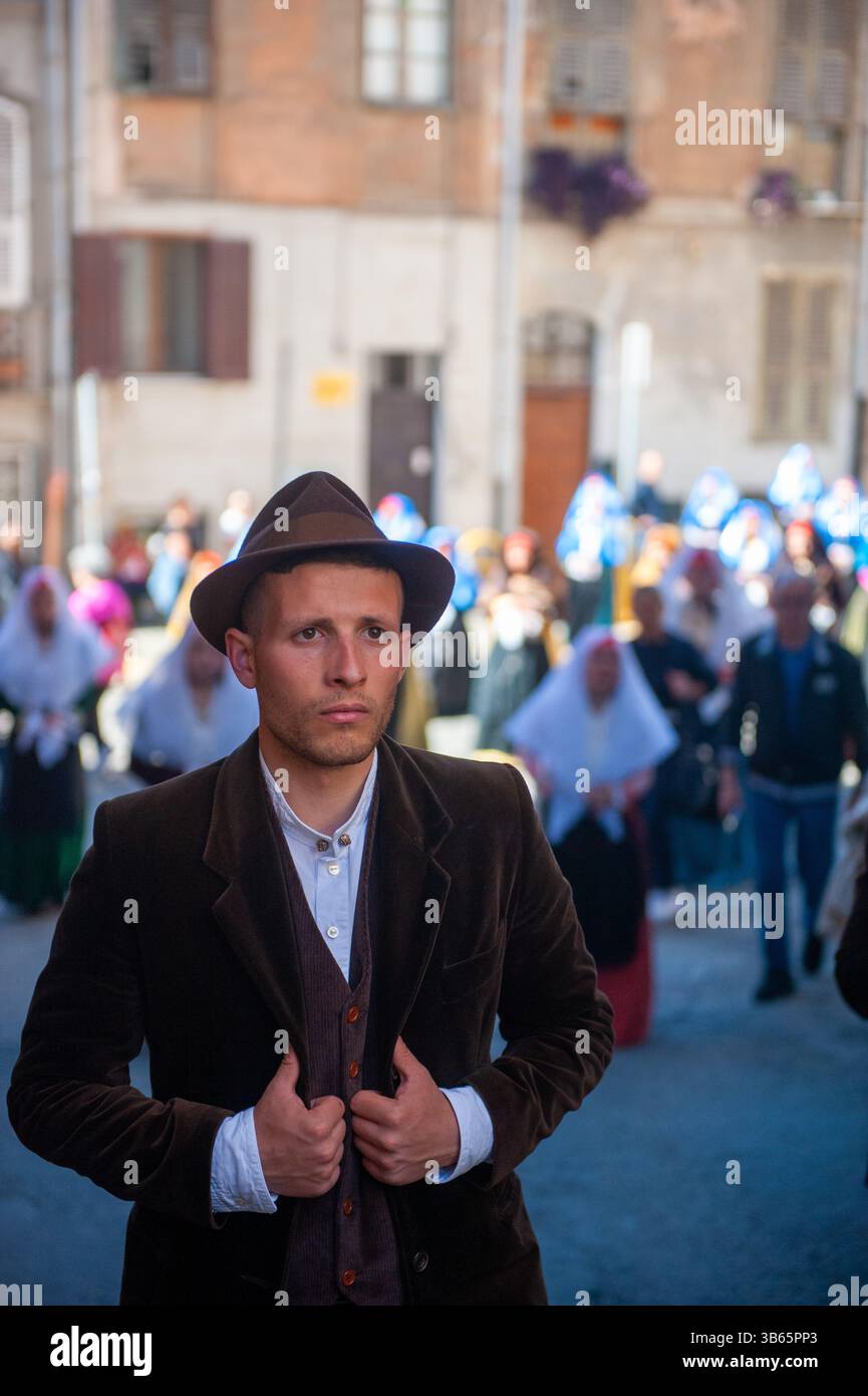 Men in traditional Sardinian attire during the Sant'Efisio celebration ...