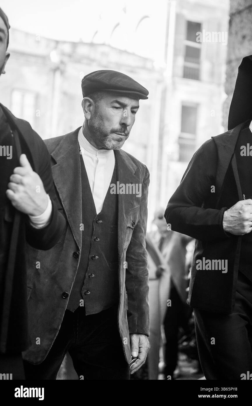 Men in traditional Sardinian attire during the Sant'Efisio celebration ...