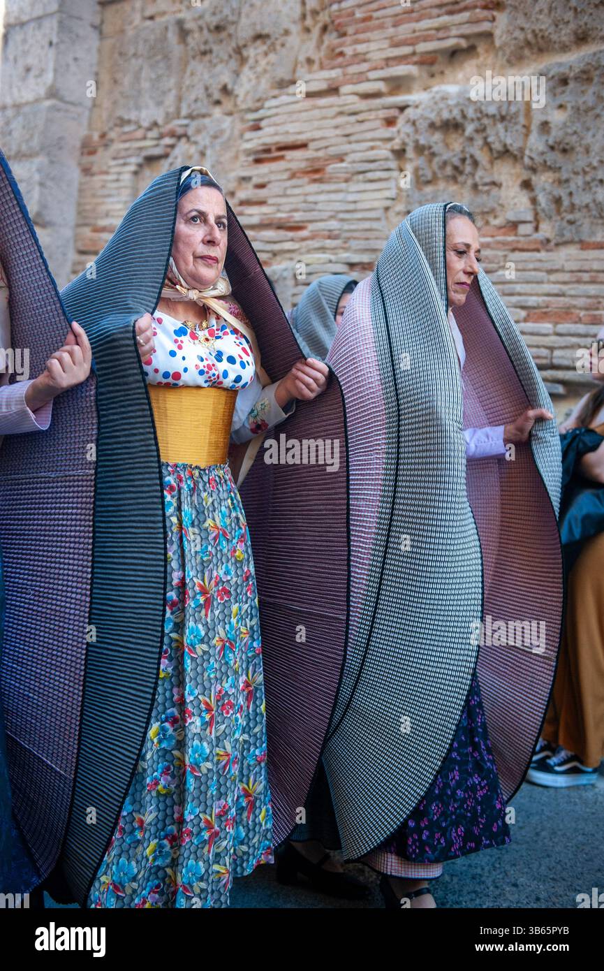 Women in traditional Sardinian dress during the Sant'Efisio celebration ...