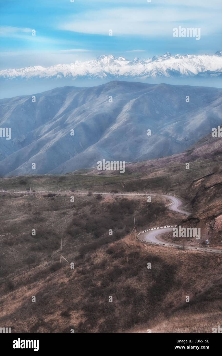 A winding road climbs the Ushkonyr mountain plateau, with Talgar Peak ...