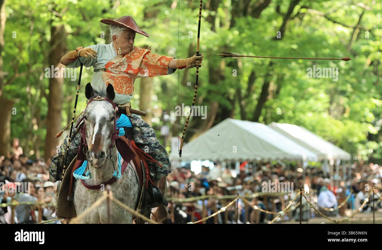 An archer releases an arrow during the Yabusame-shinji, a ritual of ...