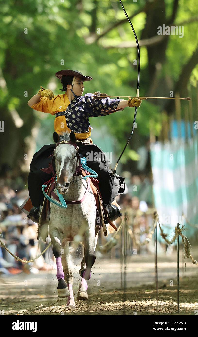 An archer releases an arrow during the Yabusame-shinji, a ritual of ...