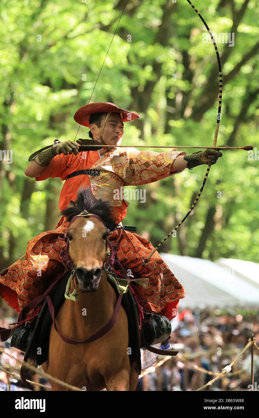 An archer releases an arrow during the Yabusame-shinji, a ritual of ...