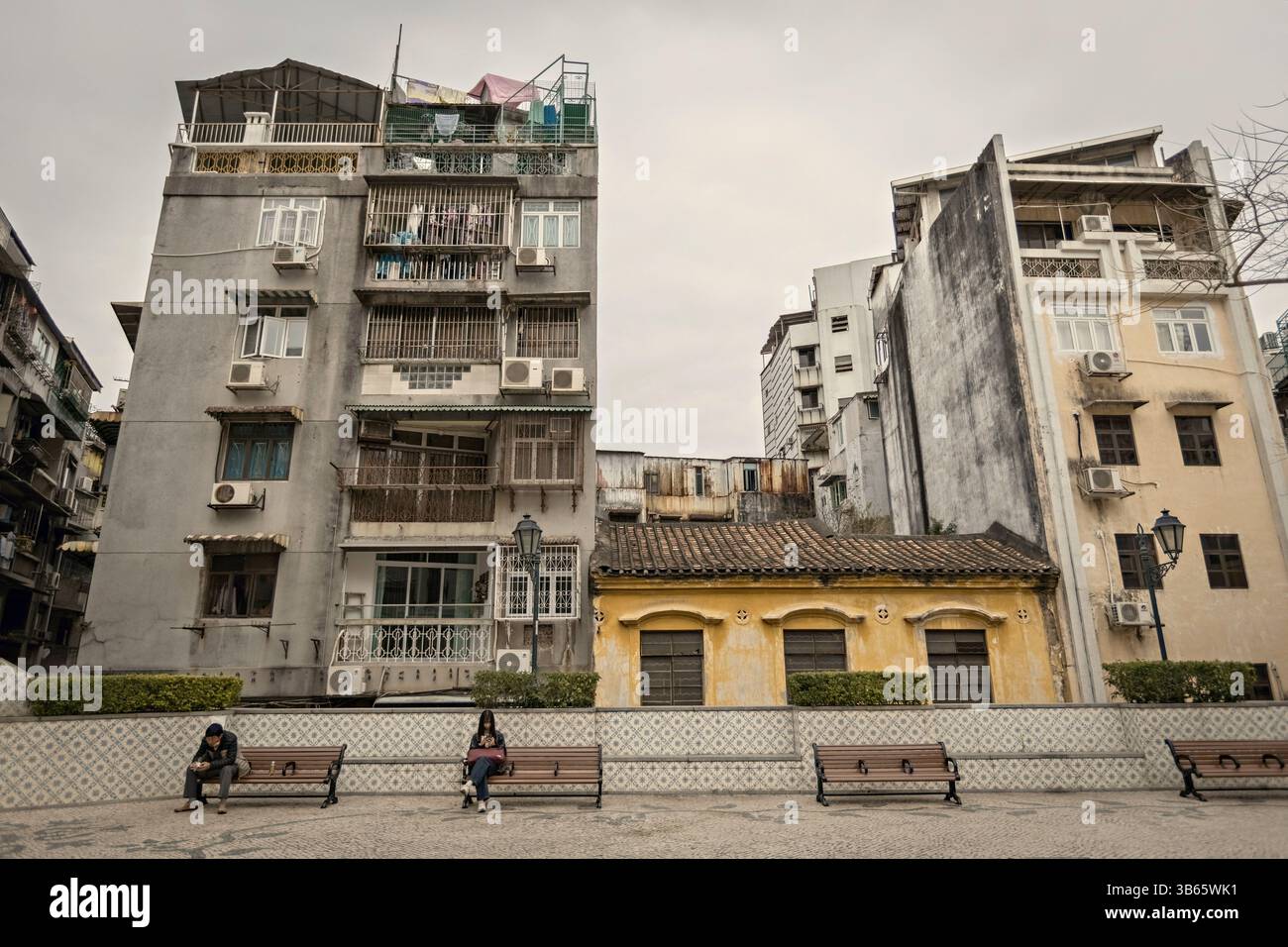Old town street in Macau, historical chinese and portuguese buildings ...