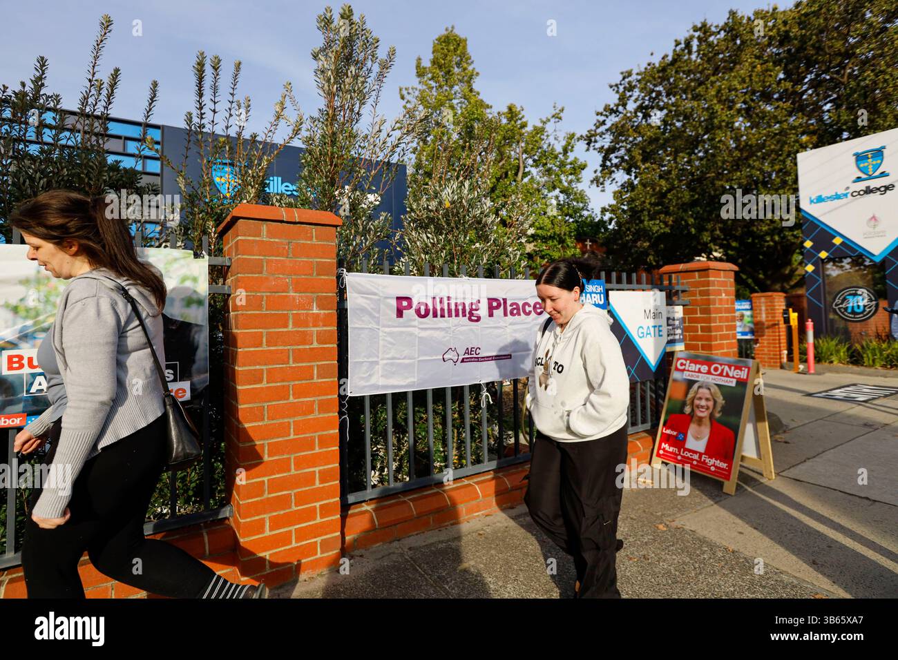 Campaign posters and signs are seen outside a polling centre on ...