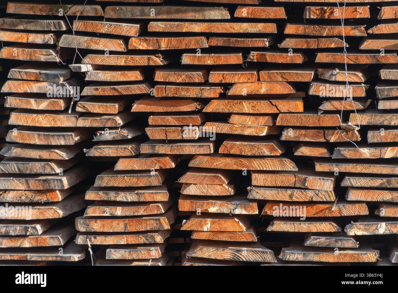 the details of a stack of wooden planks, a lumber drying setup ...