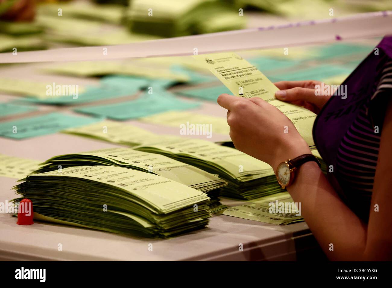 Australian Electoral Commission staff count votes during the 2025 ...