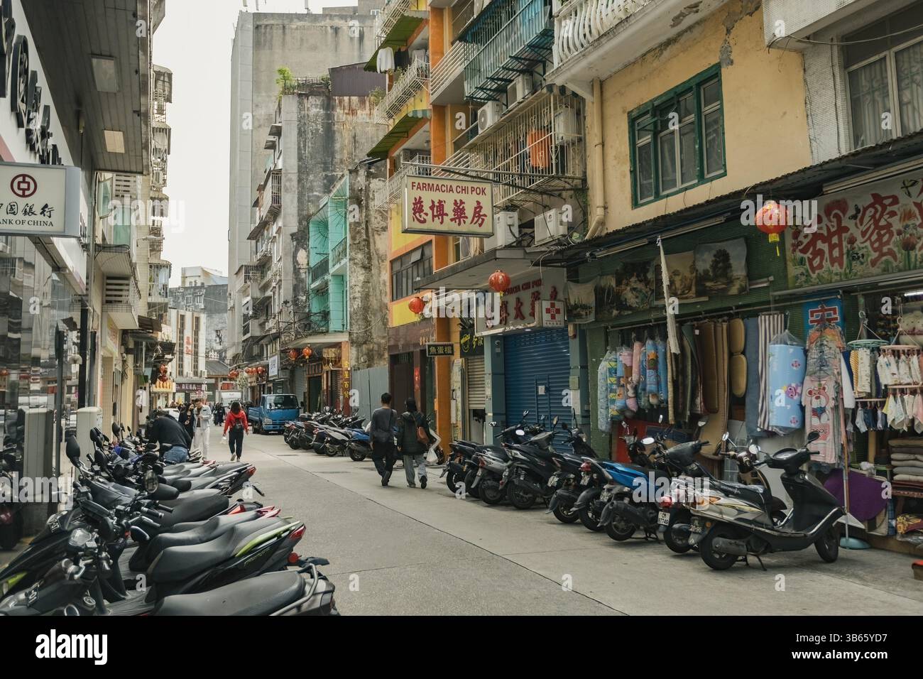Old town street in Macau, historical chinese and portuguese buildings ...
