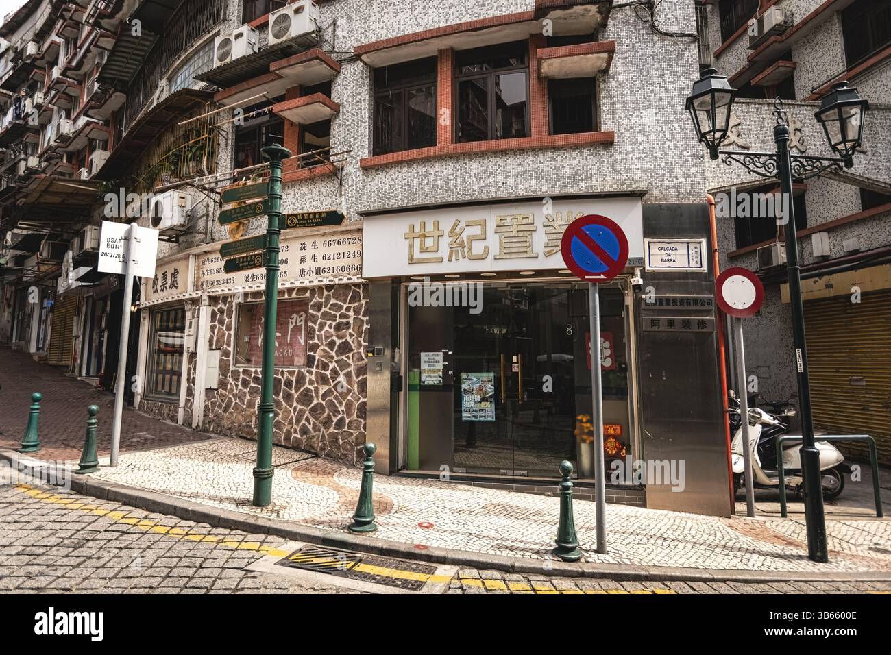 Old town street in Macau, historical chinese and portuguese buildings ...