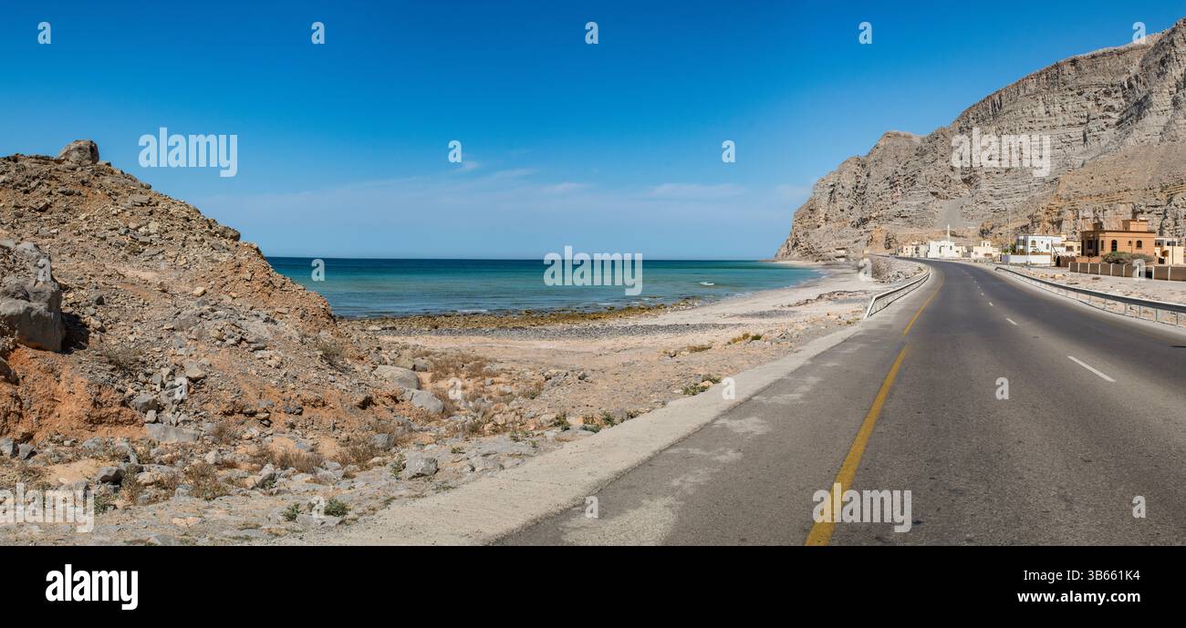 Oman: rocks and beach of the small Al Jadi fishing village in Musandam ...