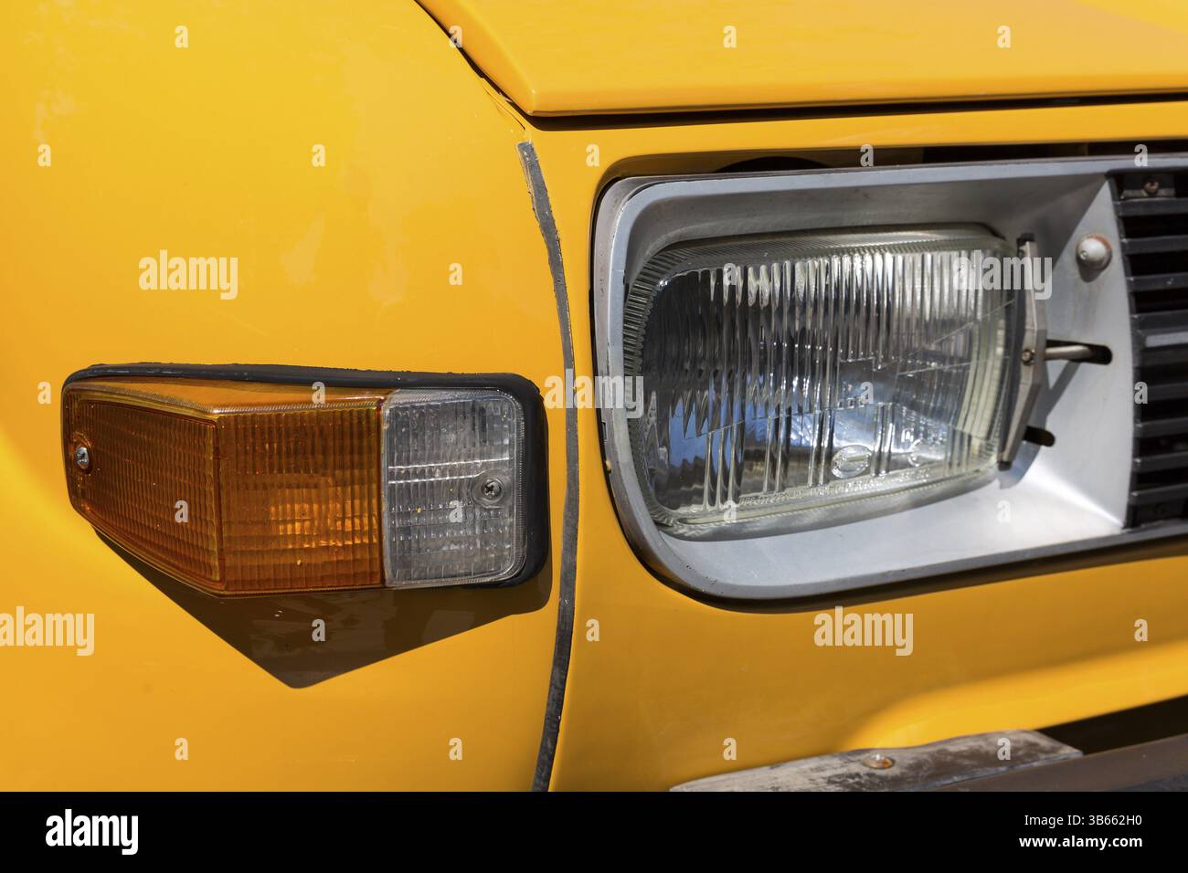 Detail of an attique car at a retro car parade. Headlights and turn ...