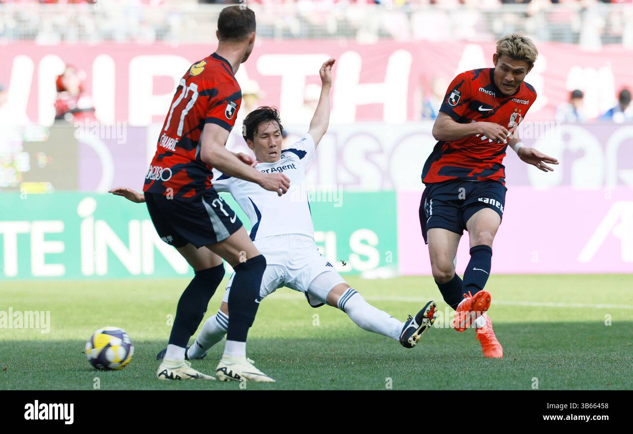 Kyosuke Tagawa of Urawa Red Diamonds scores in the first half of J1 ...