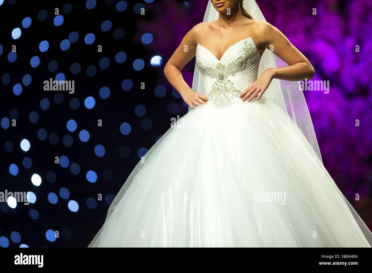 A female model walks the runway in beautiful stylish white wedding ...