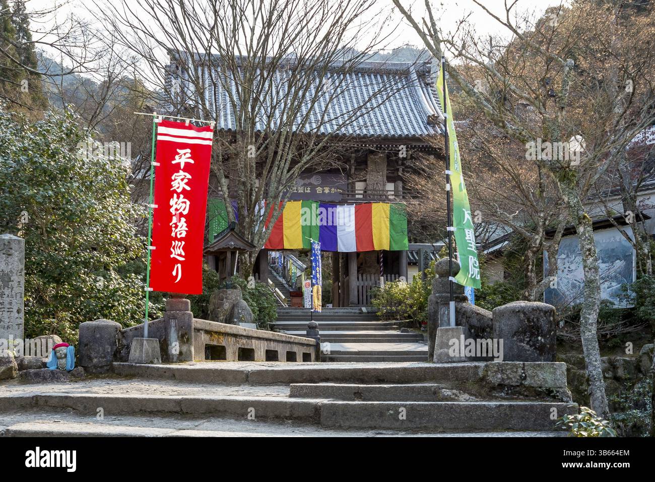 Traditional temple gate with colourful flags in Japan Stock Photo - Alamy