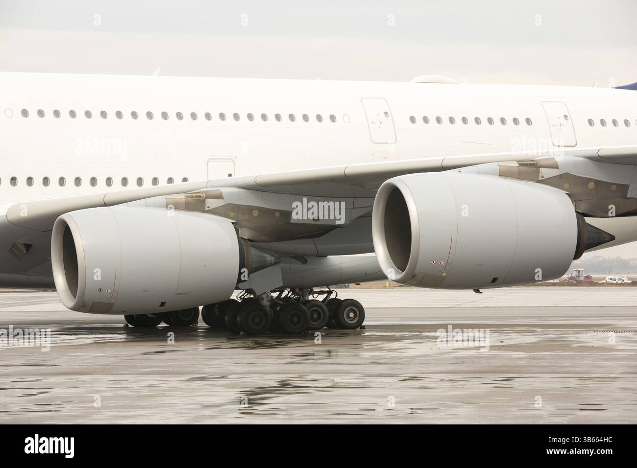 Airbus A380 airplane's engines on a wing on a runway at an airport ...
