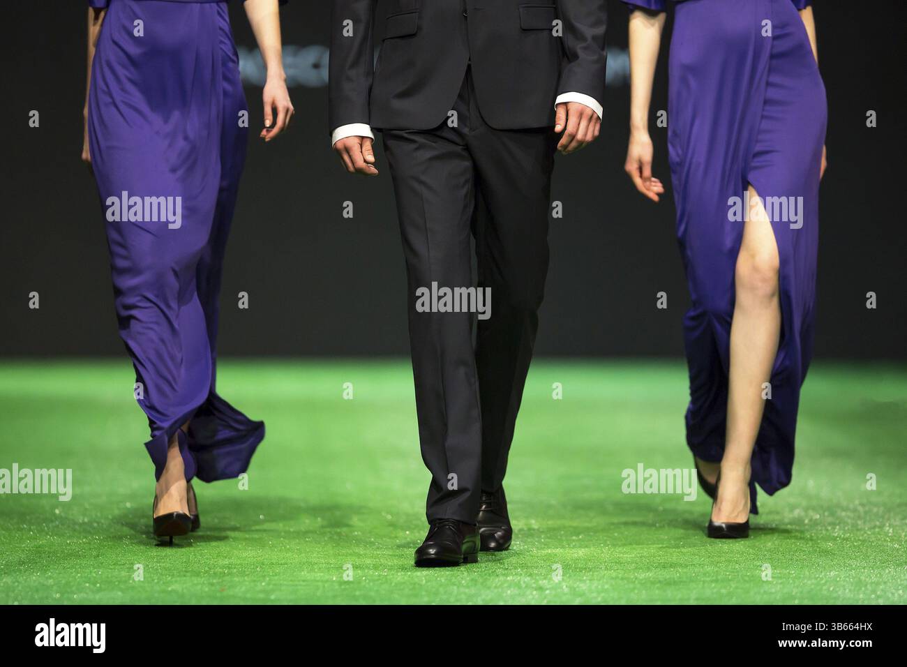 Models walk the runway during a Fashion Show. Fashion catwalk event ...