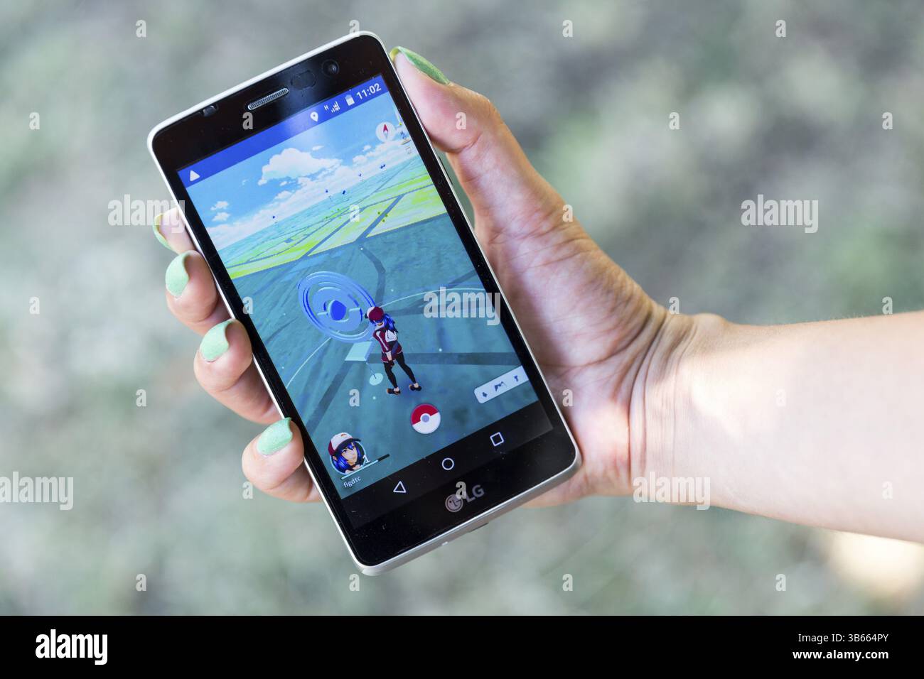 Sofia, Bulgaria - July 23, 2016: Woman holds in her hand a mobile phone ...
