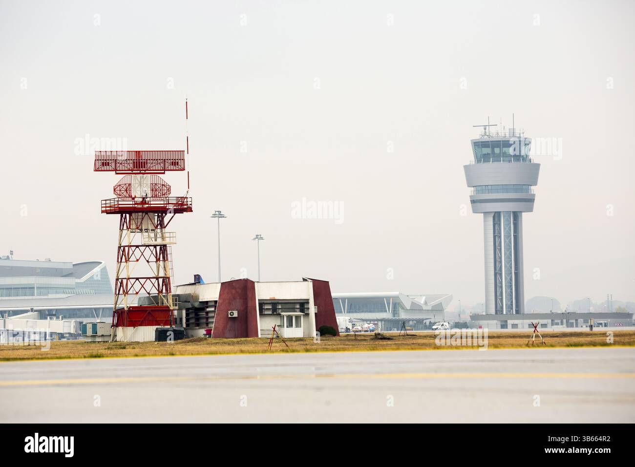 Airport control tower (right) and radar communication tower (left) at ...