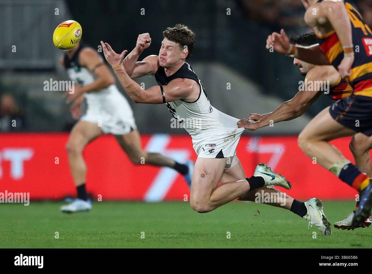 Adelaide, Australia. 03rd May, 2025. Sam Walsh of the Blues is tackled ...