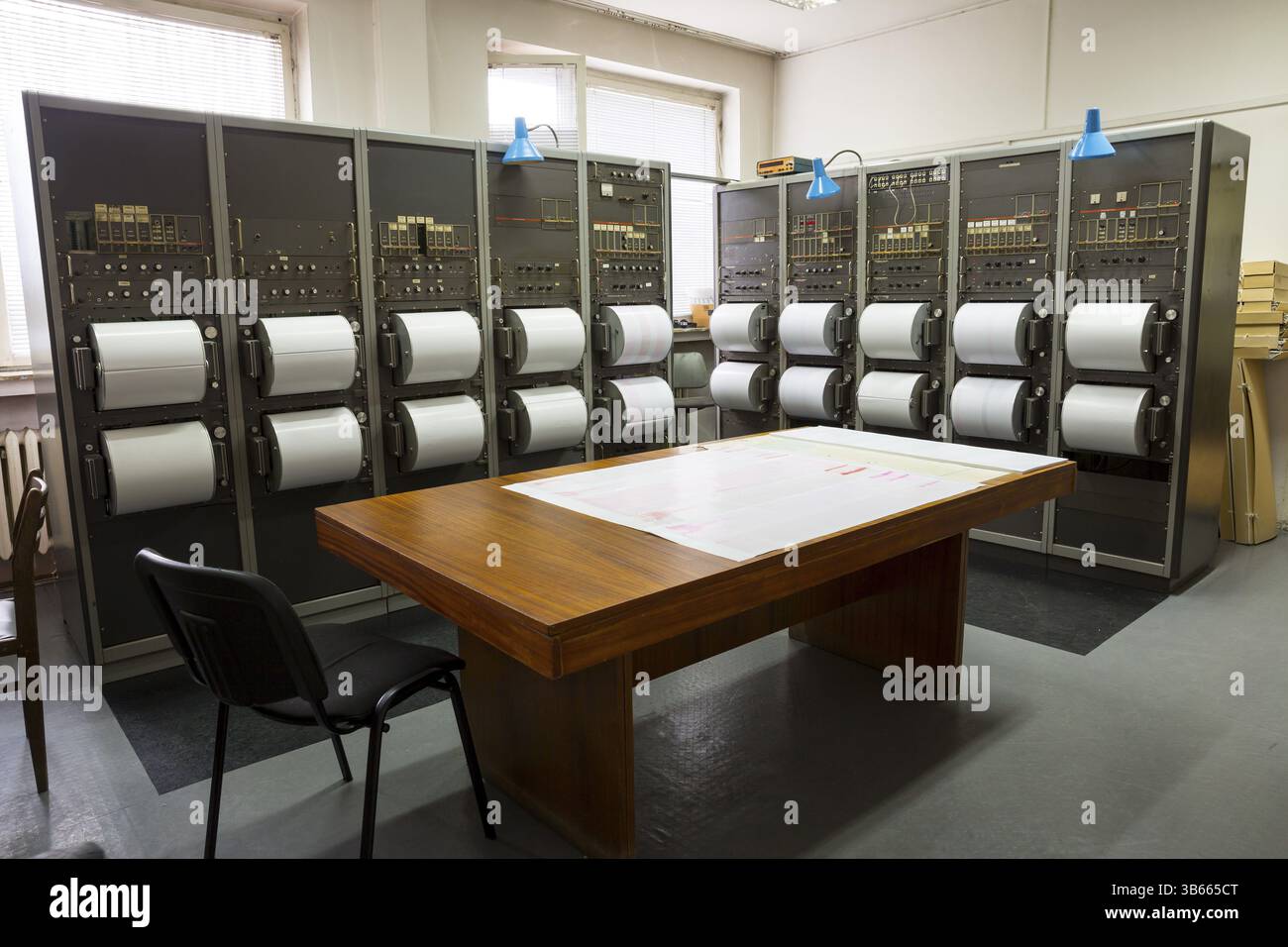 Ten seismographs recording earthquakes on the sheet of measuring paper ...