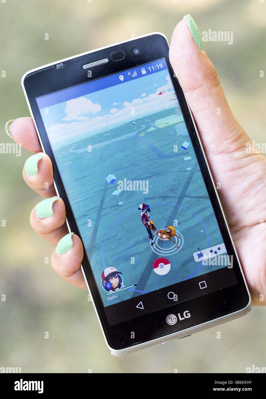 Sofia, Bulgaria - July 23, 2016: Woman holds in her hand a mobile phone ...