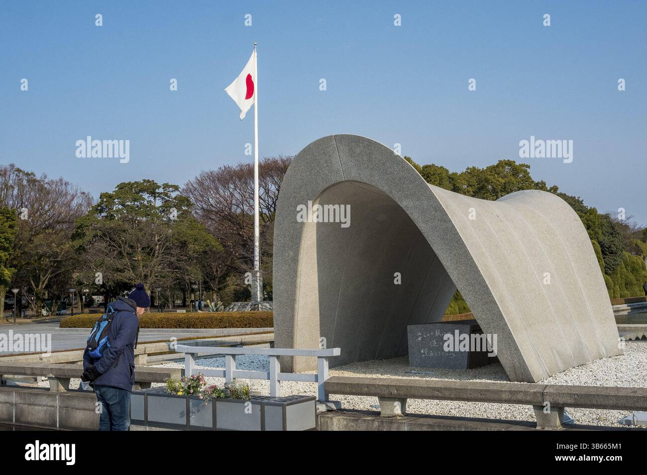 Hiroshima peace memorial with Japanese flag and visitors Stock Photo ...