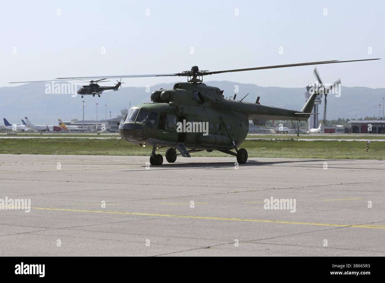 Military helicopters at the runway of the airport Stock Photo - Alamy