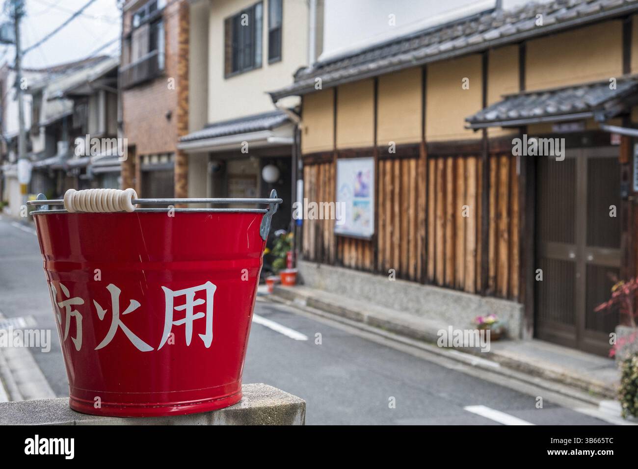 Tradition meets safety - fire extinguisher buckets in Kyoto Stock Photo ...