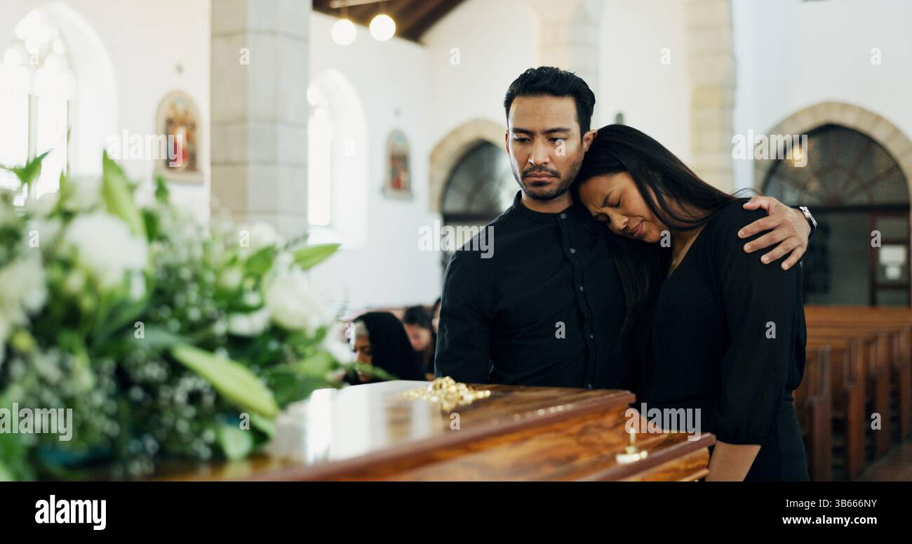 Couple, coffin and embrace at funeral for death, pay respect or comfort ...