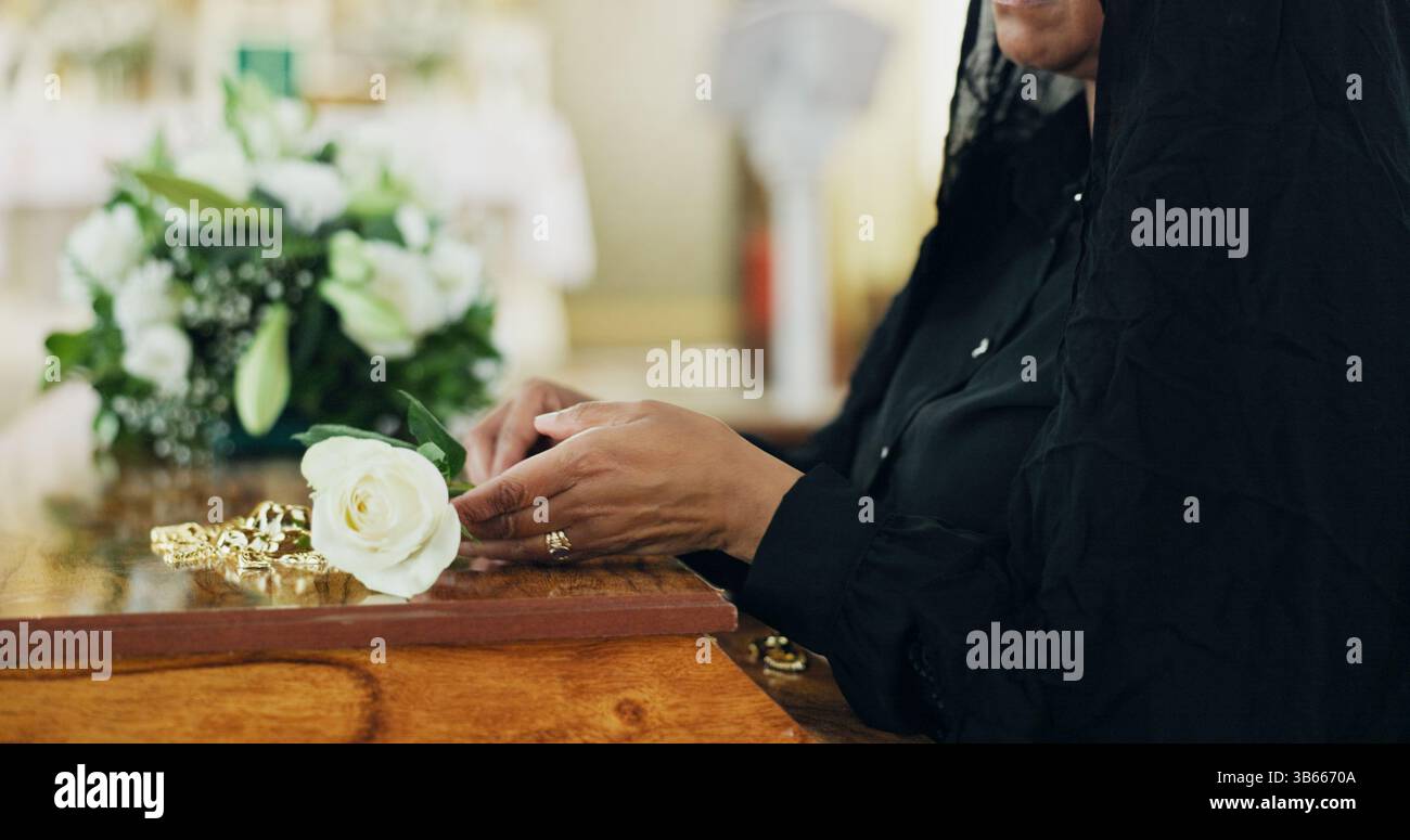 Hands, person and coffin with rose at funeral for farewell, mourning ...