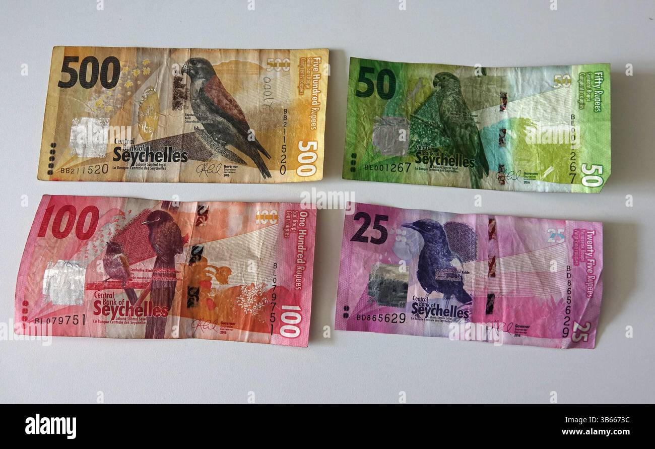 Berlin, Germany. 16th Mar, 2025. Various Seychelles rupee bills lie on ...