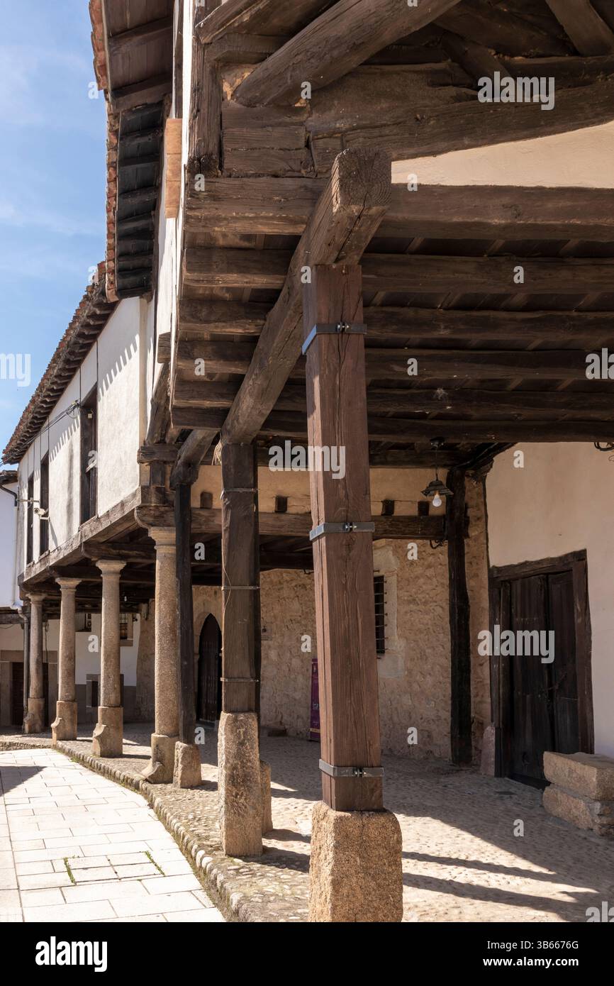 Wooden beams and stone pillars supporting a traditional spanish ...