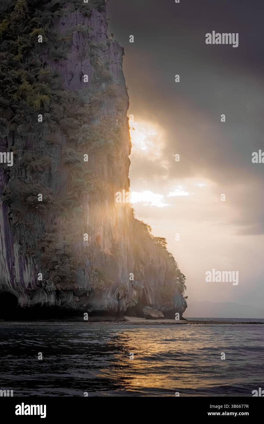 This stunning image captures a dramatic seascape at sunset. The ...