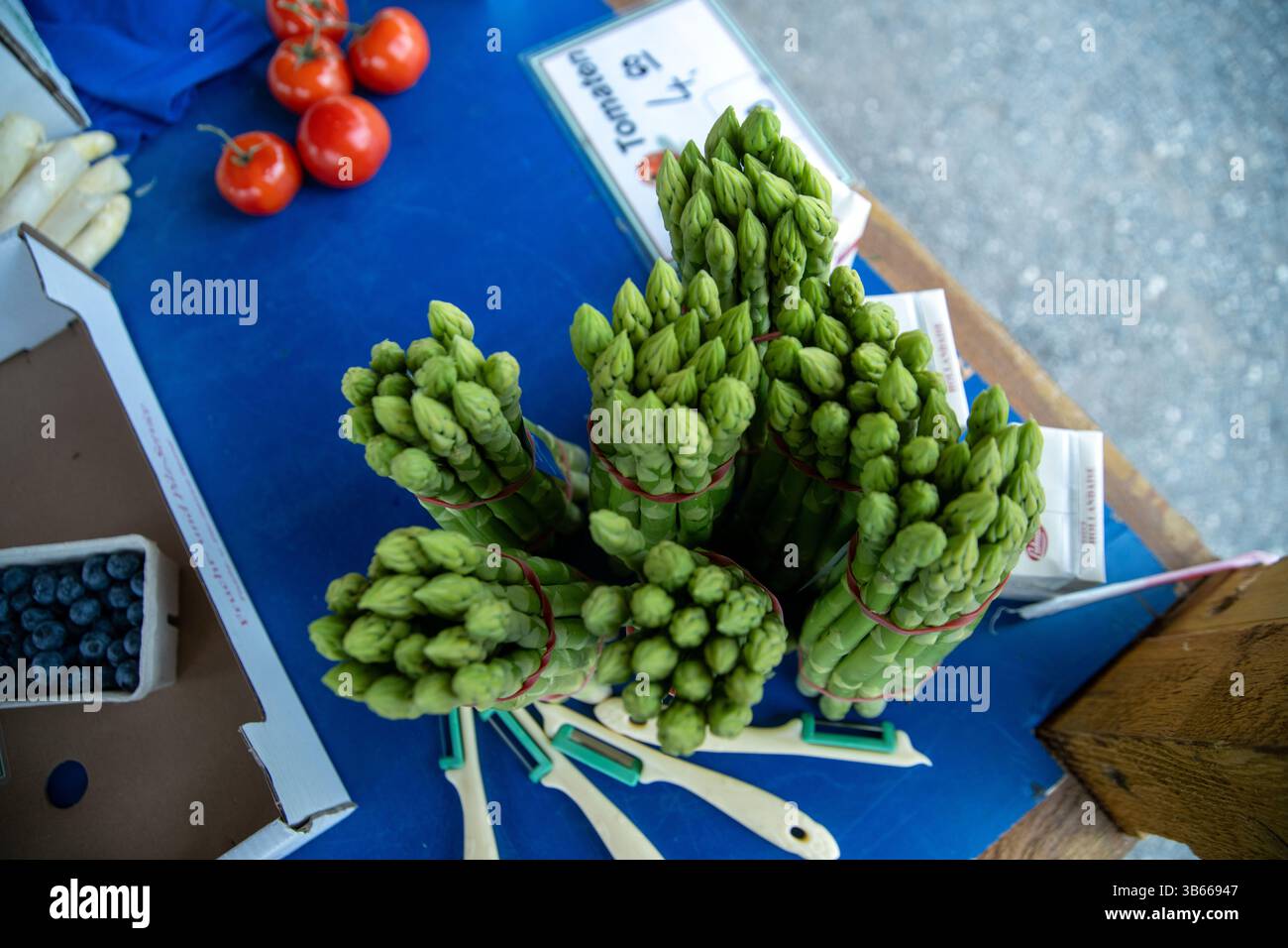 Frohnlach, Germany. 03rd May, 2025. Fresh green asparagus stands on a ...