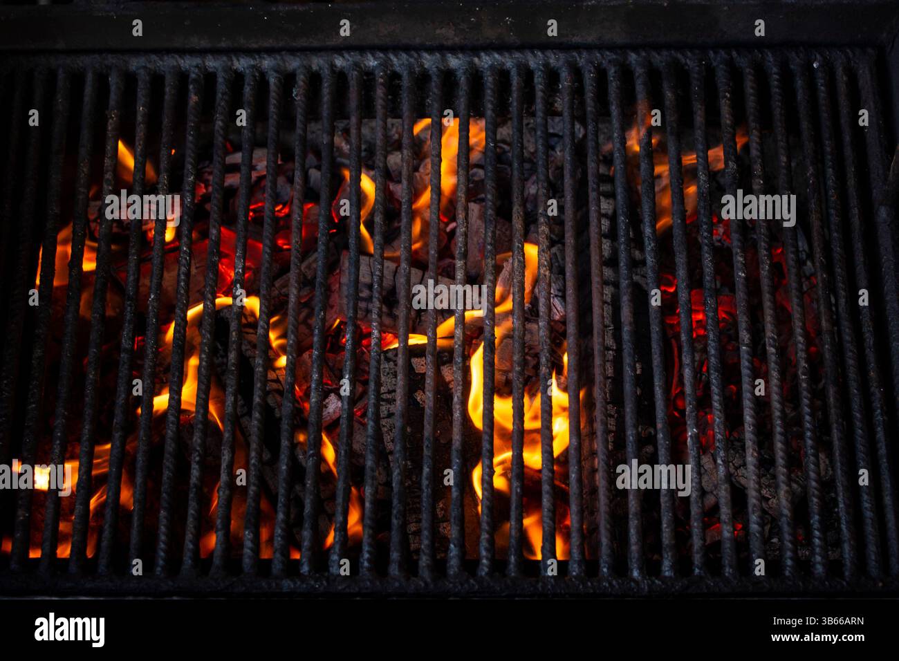 Empty grill with orange flames, abstract perspective barbecue backdrop ...