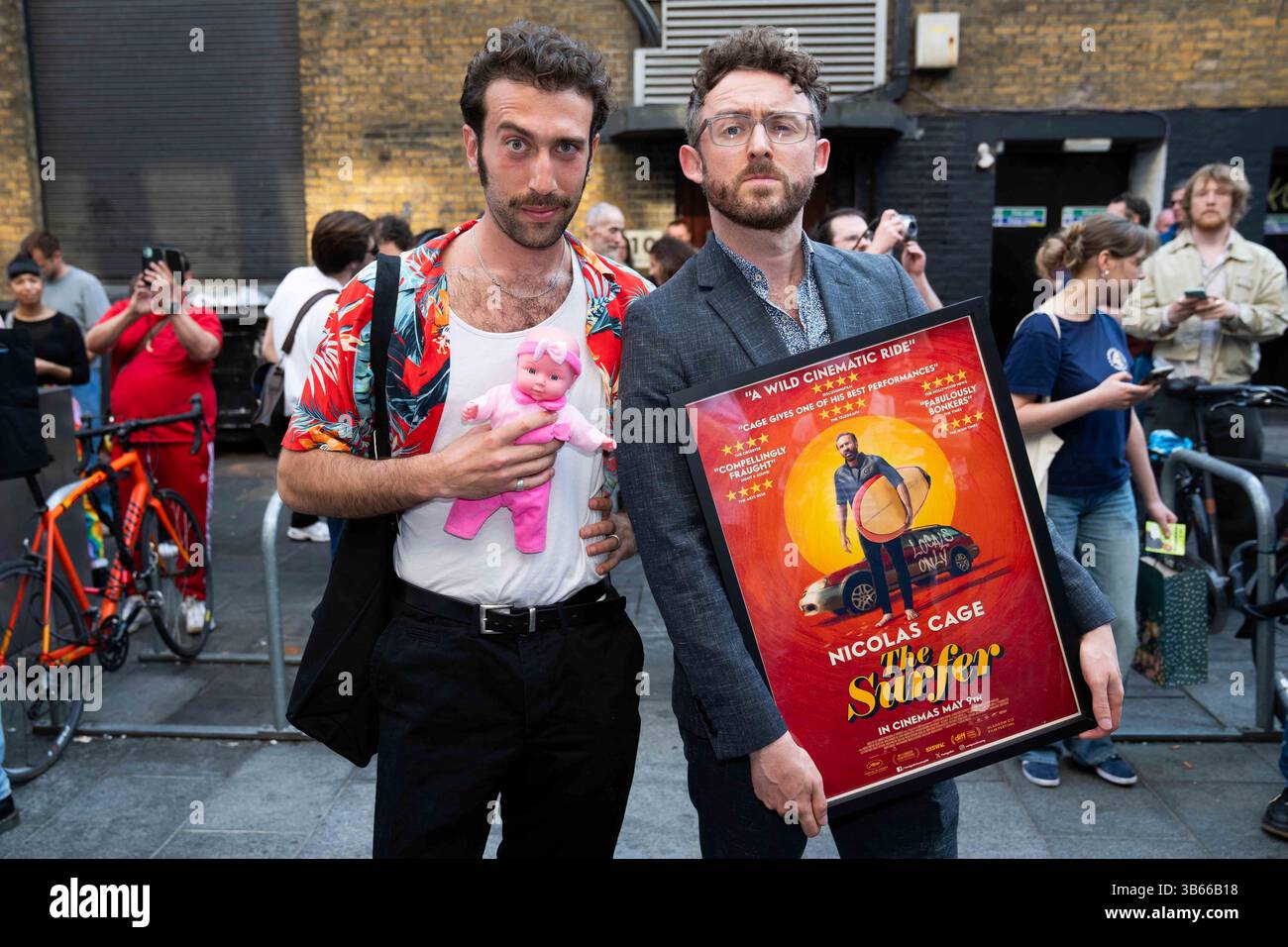Winner Daniel Breuer, left, and Ali Plumb pose for a photograph at the ...