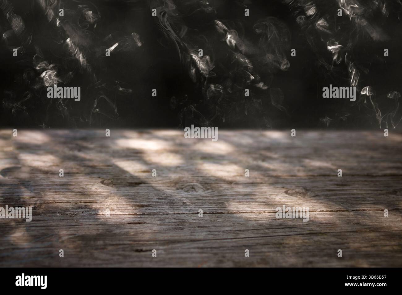 Moon light rays thru foliage at night, on weathered wood boards table ...