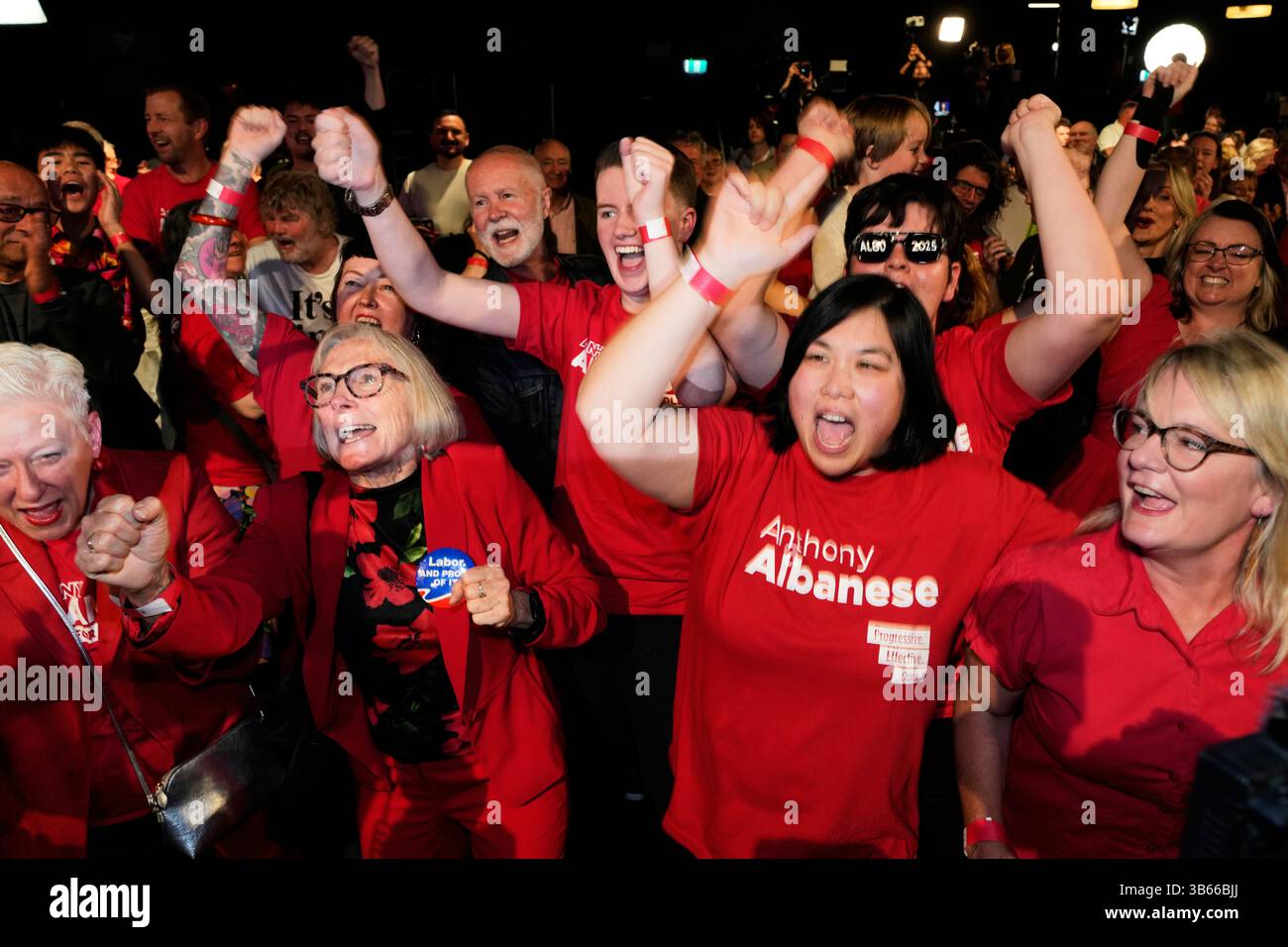 Labor Party supporters react as results are shown on a screen at their ...