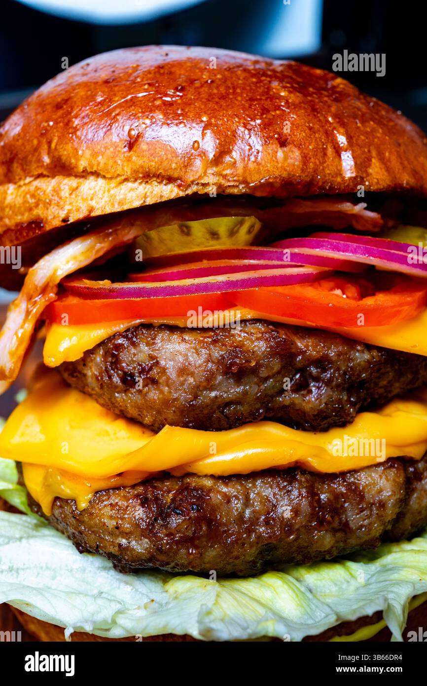 A mouthwatering double cheeseburger stacked with two beef patties ...