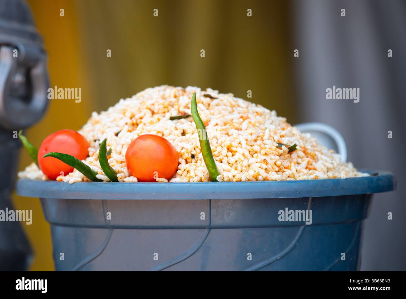 Rice and millet with tomato, green pepper chilli in a bowl, indian ...