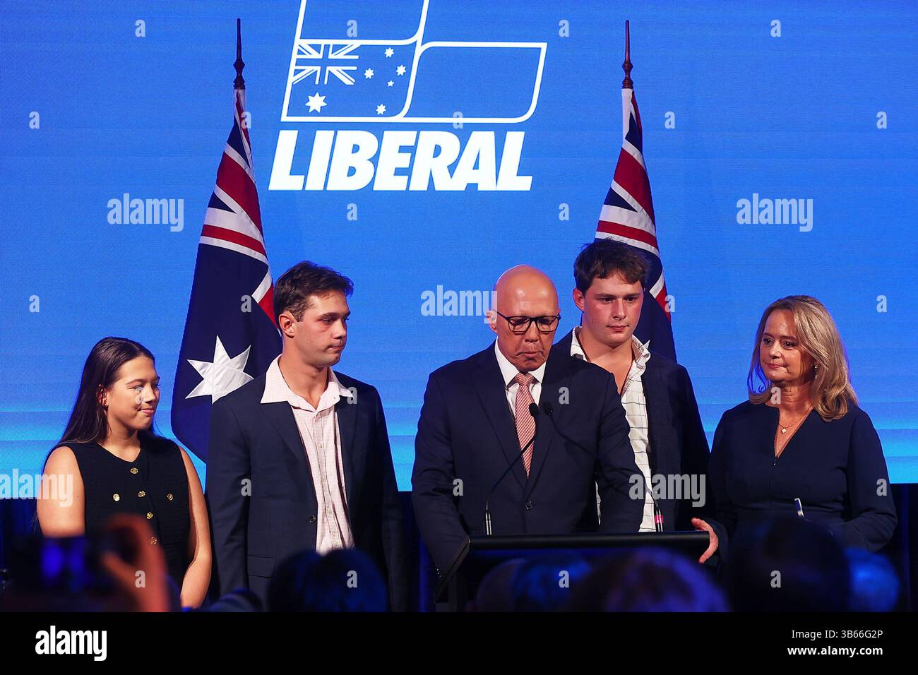 Australian Liberal Party leader Peter Dutton, center, stands with his ...