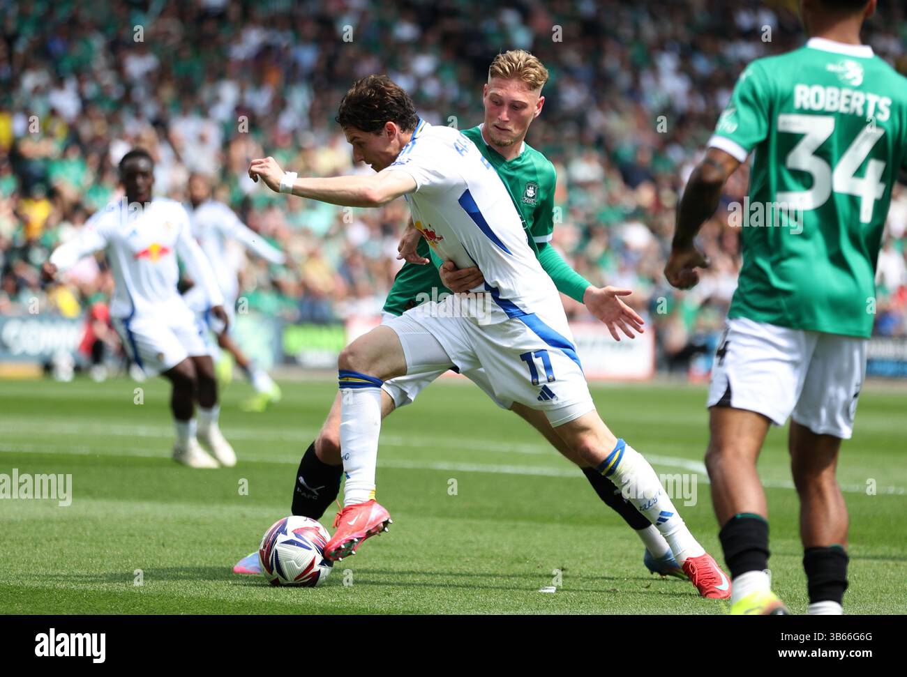 Leeds United's Brenden Aaronson (left) and Plymouth Argyle's Kornel ...