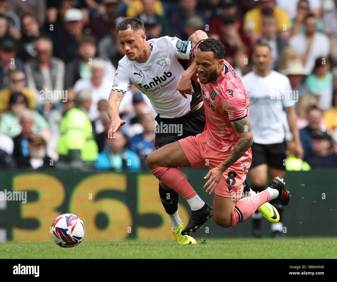 Derby County's Jerry Yates (left) and Stoke City’s Lewis Baker battle ...