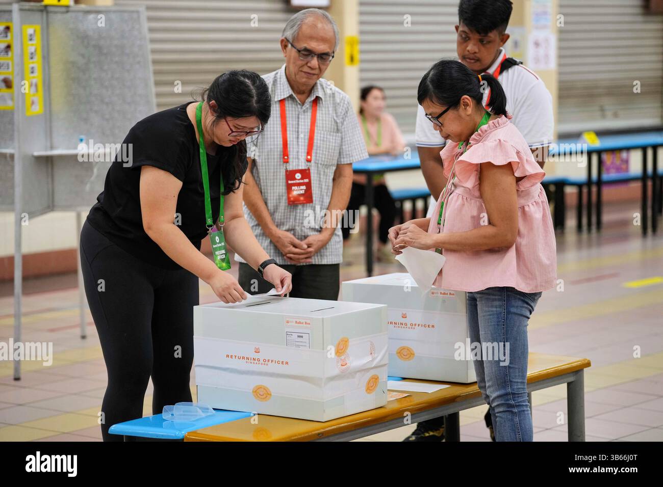 Officials at a polling station seal the ballot box after the voting ...