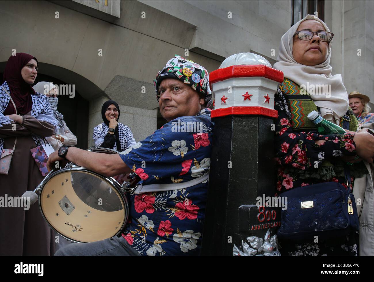 Protesters gather outside court before the demonstration. Supporters of ...