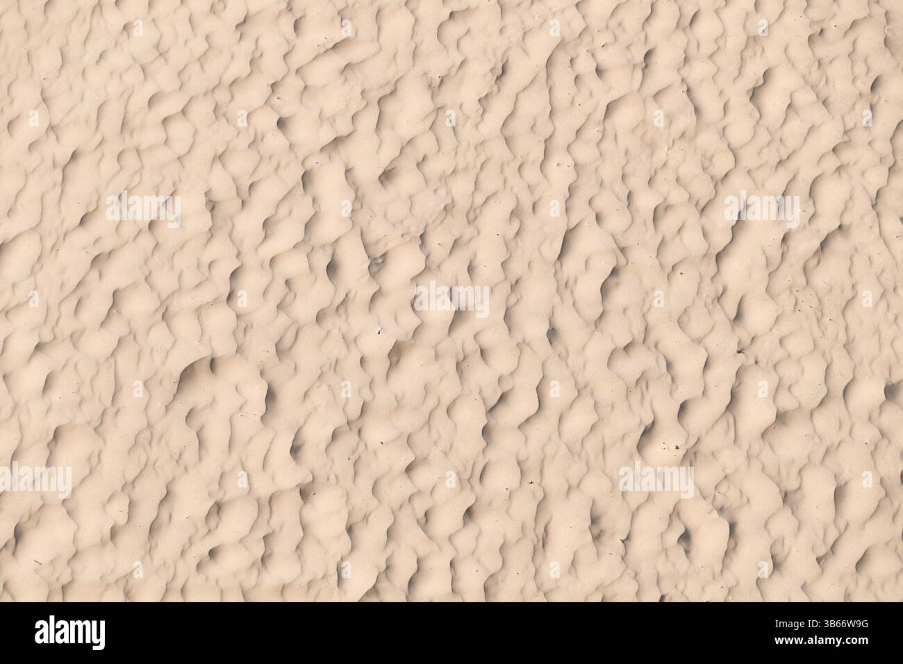 Aerial view of textured sandy desert surface with ripples Stock Photo ...